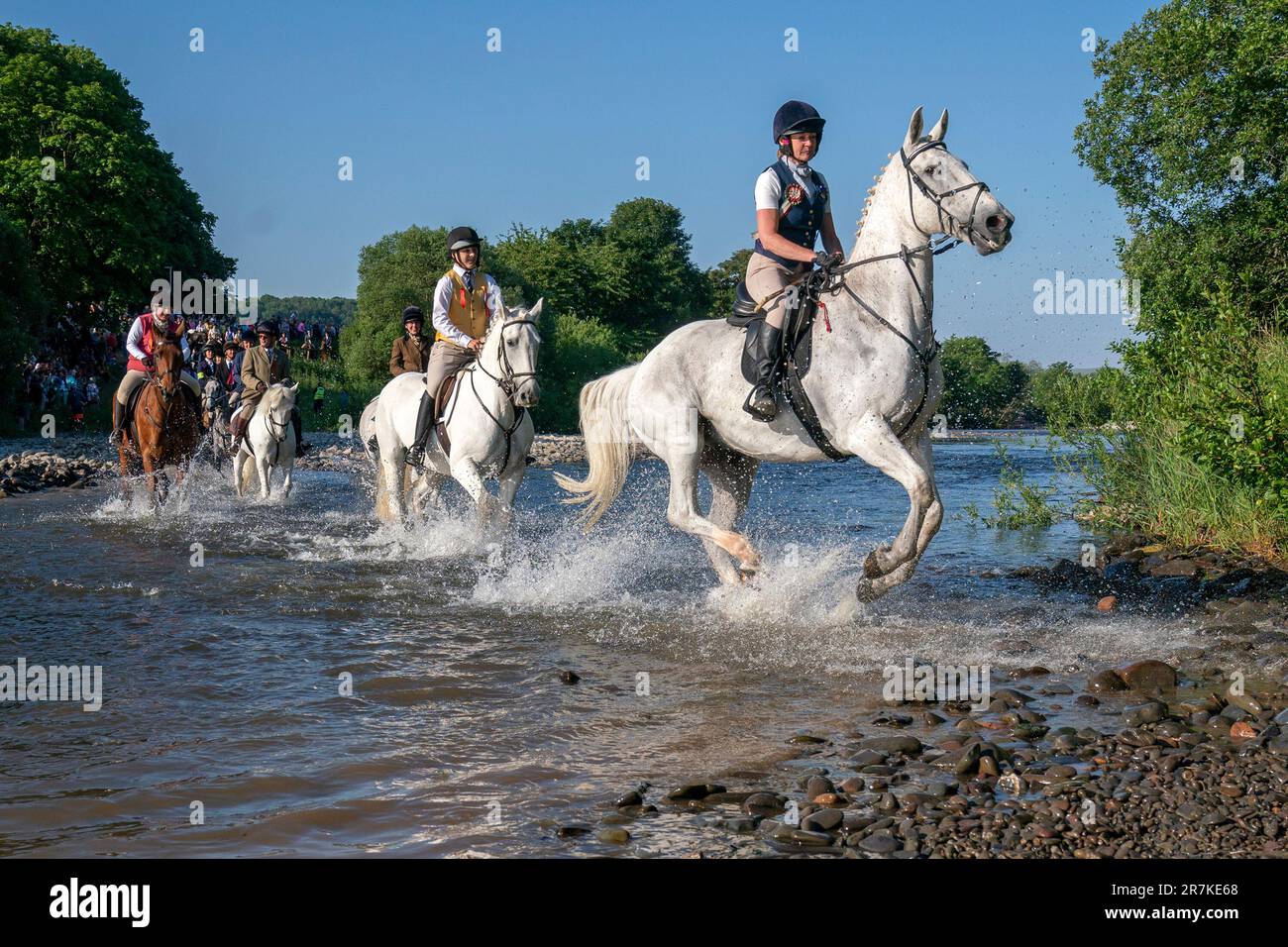 Riders ford the River Ettrick during the Selkirk Common Riding, a ...