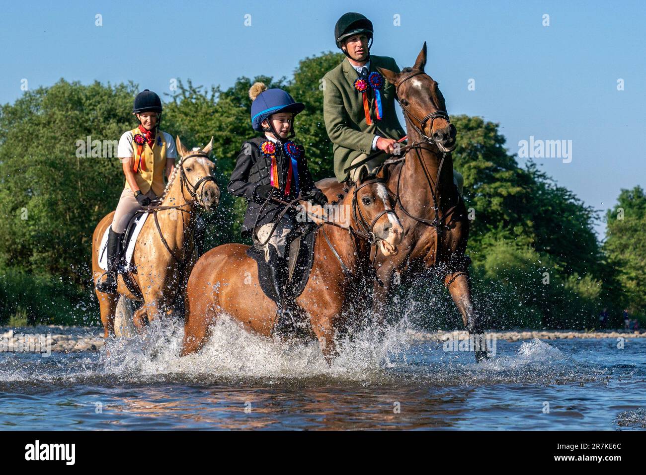 Riders ford the River Ettrick during the Selkirk Common Riding, a ...