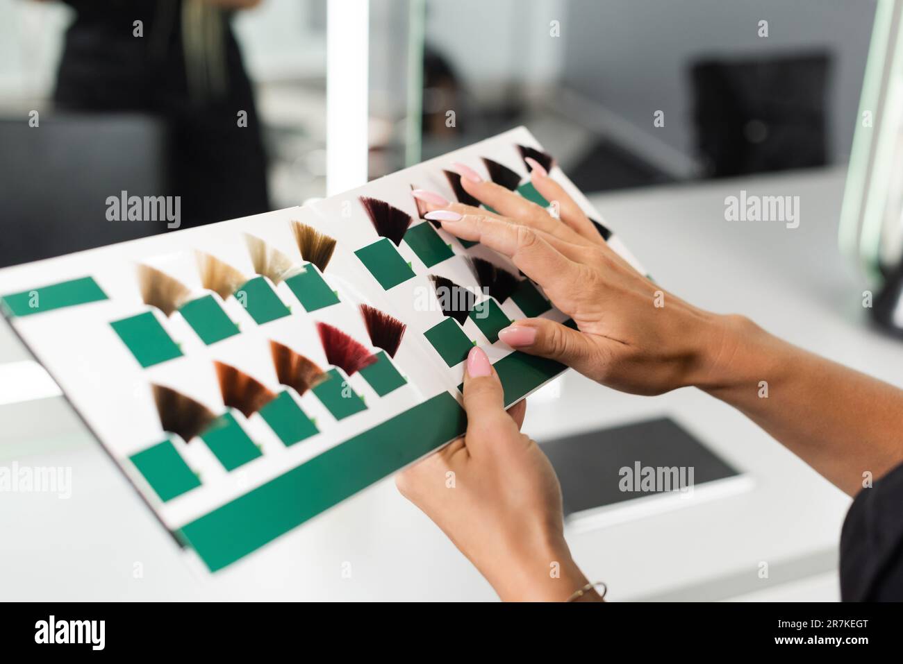 cropped, hair professional, beauty worker holding hair color palette in ...