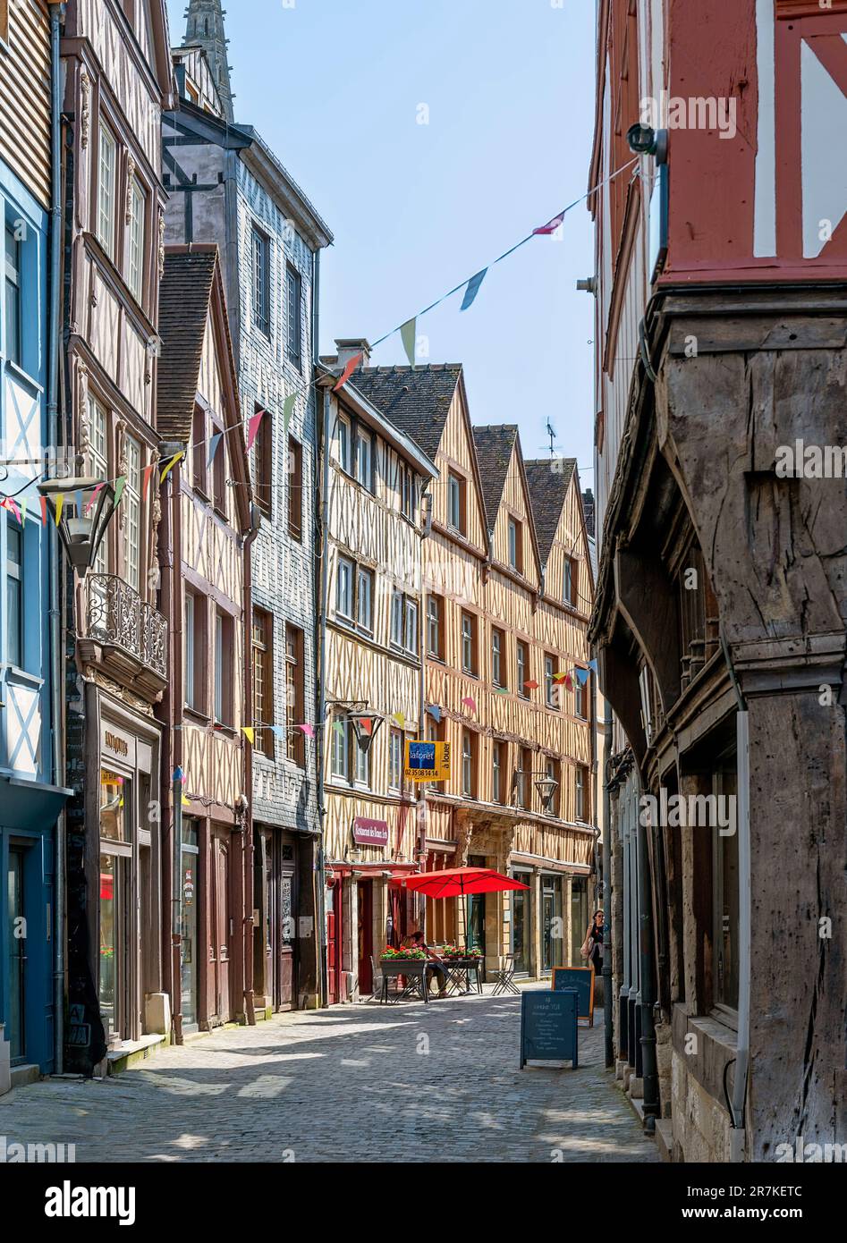 narrow medieval street with half-timbered houses in the center of Rouen ...
