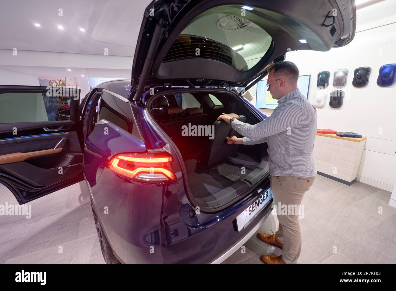 Stuttgart, Germany. 16th June, 2023. An employee demonstrates the trunk ...