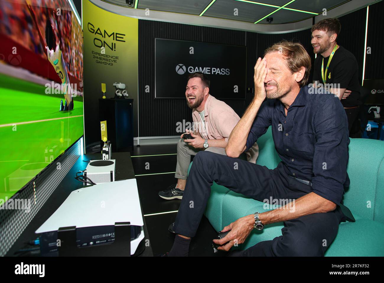 EDITORIAL USE ONLY Peter Crouch (right) attends the opening of the new ...