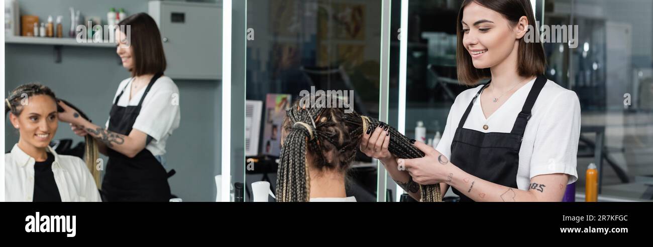 beauty worker and client, beauty salon, tattooed hair stylist doing ...