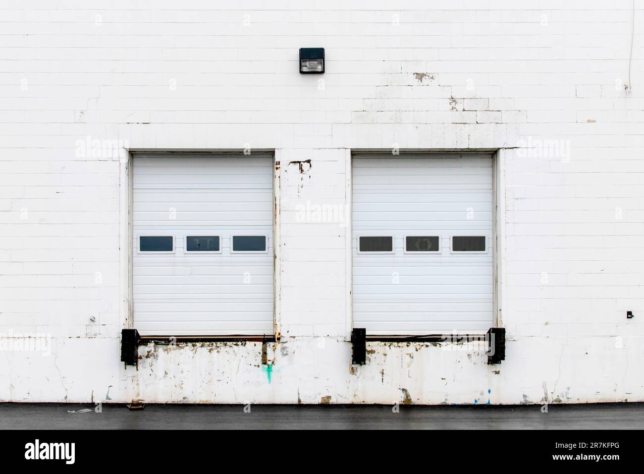 Front view of a truck loading bay with rubber bumpers in the white ...