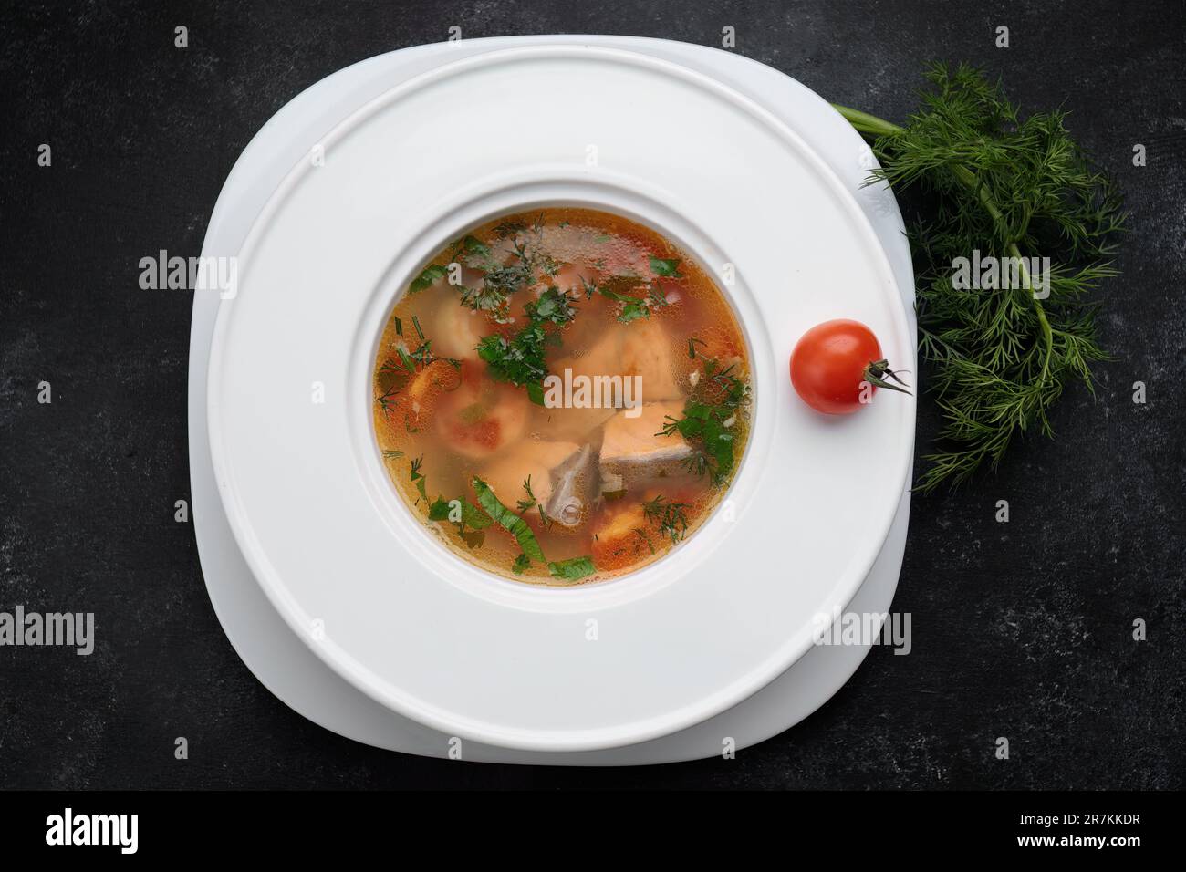 Red fish ear with tomatoes, garlic and spices Stock Photo - Alamy