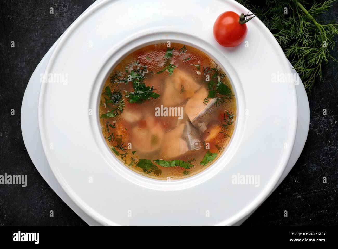 Red fish ear with tomatoes, garlic and spices Stock Photo - Alamy