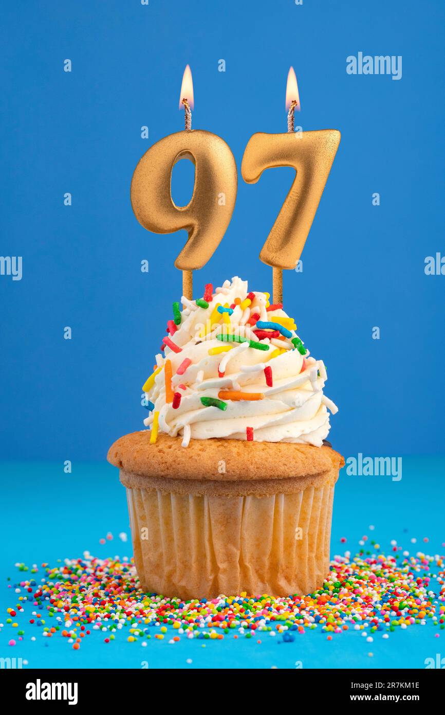 Candle number 97 - Cake birthday in blue background Stock Photo - Alamy
