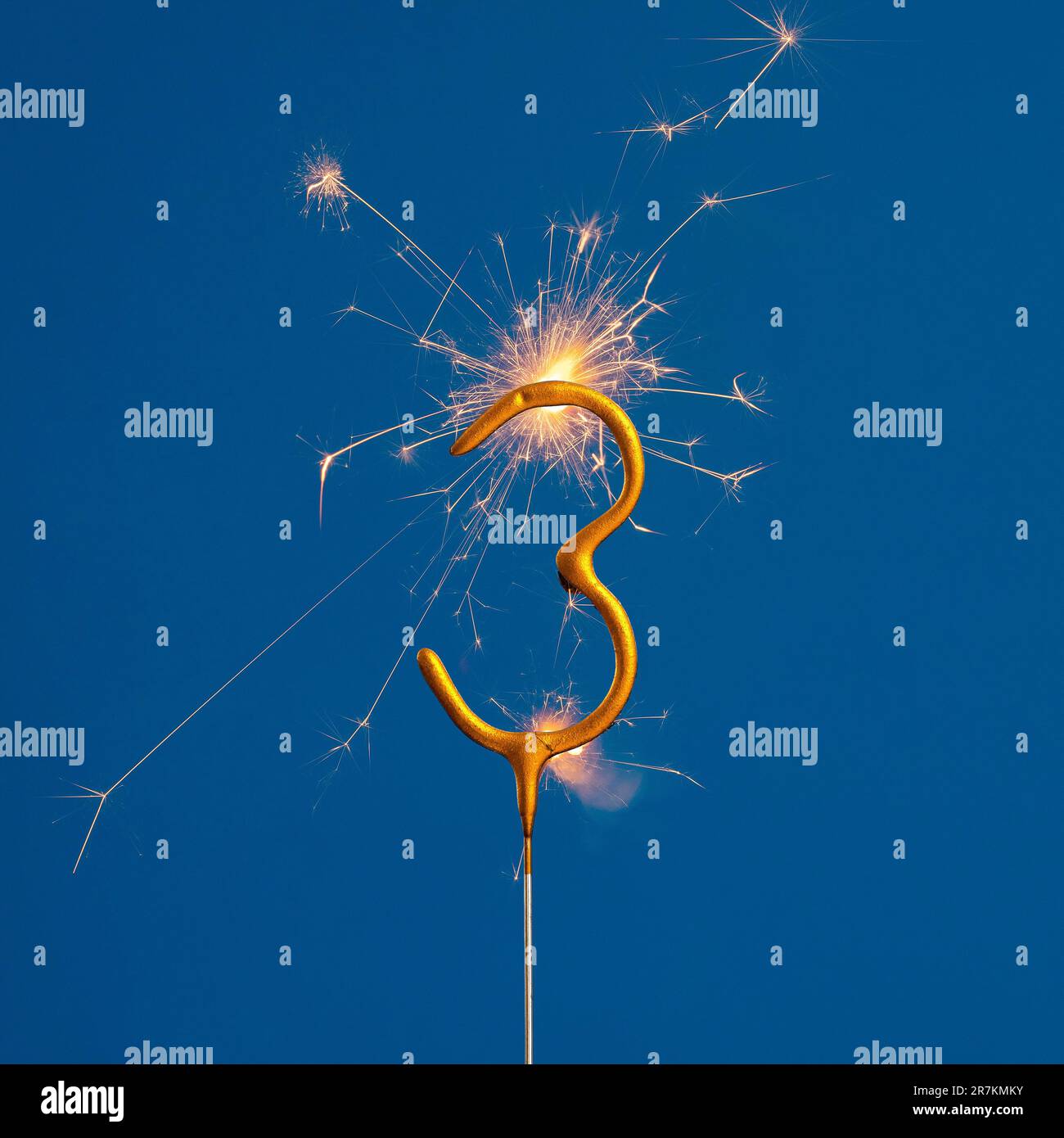 Birthday number 3 of sparks on blue background Stock Photo - Alamy