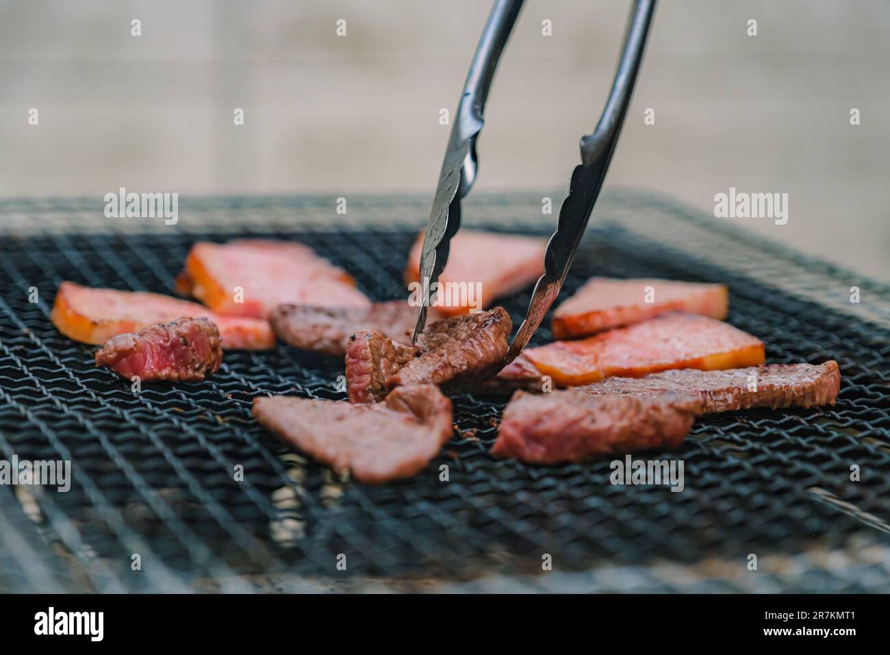 Wagyu beef bbq on the charcoal grilling on hot nice summer day in Japan ...