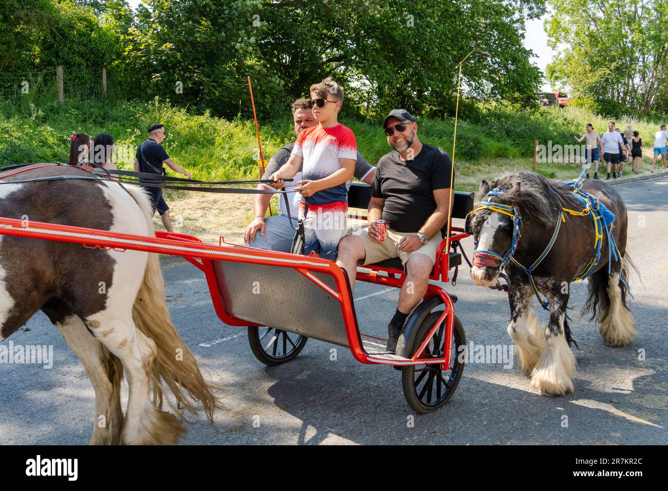 People in a horse drawn exercise cart go along 'The Flashing Lane' at ...