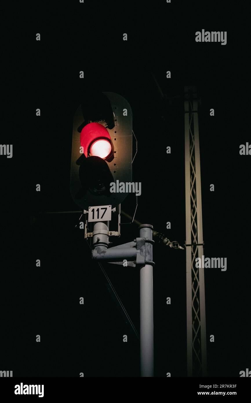 A close-up of a red traffic light illuminated in dark at night Stock ...