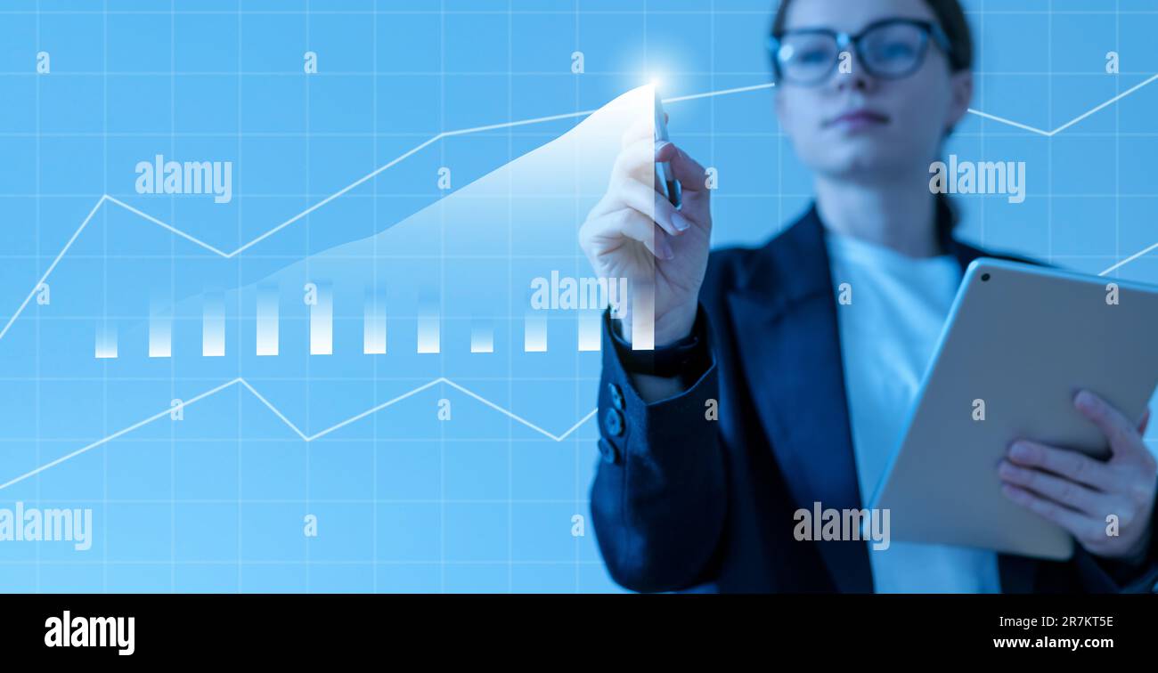 Businesswoman drawing global financial graph on virtual screen Stock ...