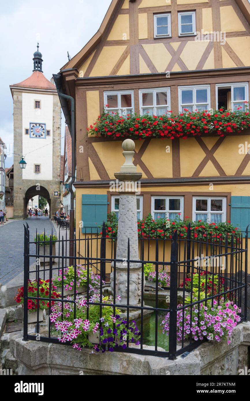 A fountain in Plönlein with Siebers tower, Rothenburg ob der Tauber ...
