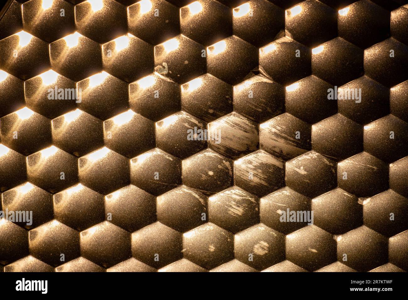 An aged metallic wallpaper background with a distinct shadow cast ...