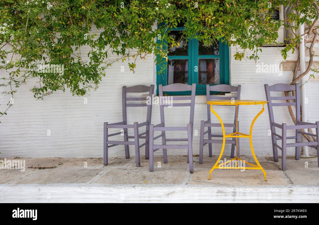 Outdoors traditional empty cafe in Greece, Tinos island Hora town ...