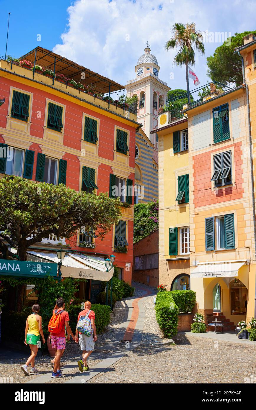 People walking up cobbled street to Chiesa del Divo Martino, Portofino ...