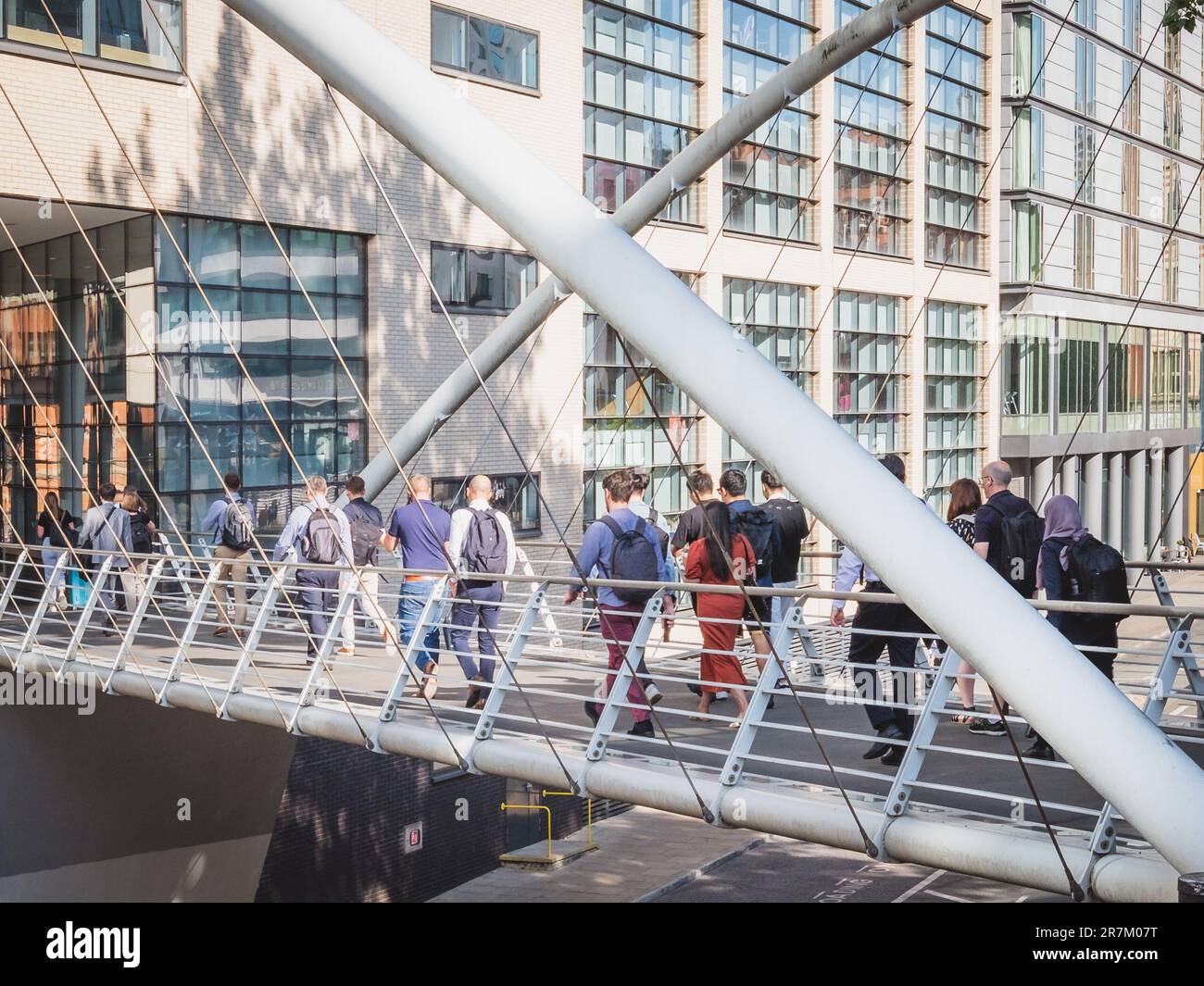 Commuters and city workers on the butterfly bridge at Manchester ...