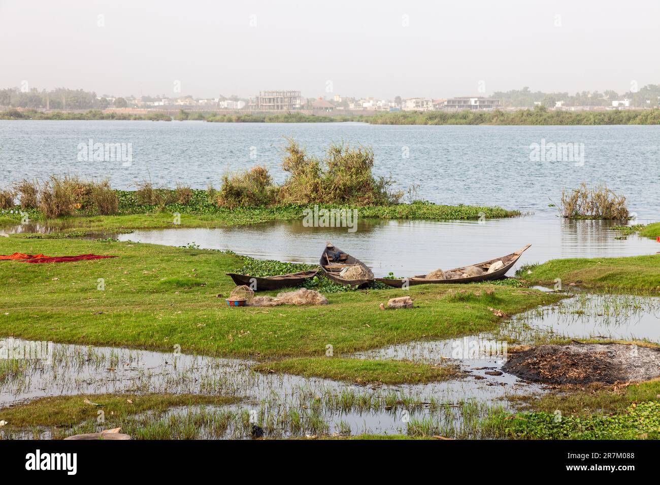 Fishing canoes stranded on a bank of the Niger River in Bamako, Mali ...