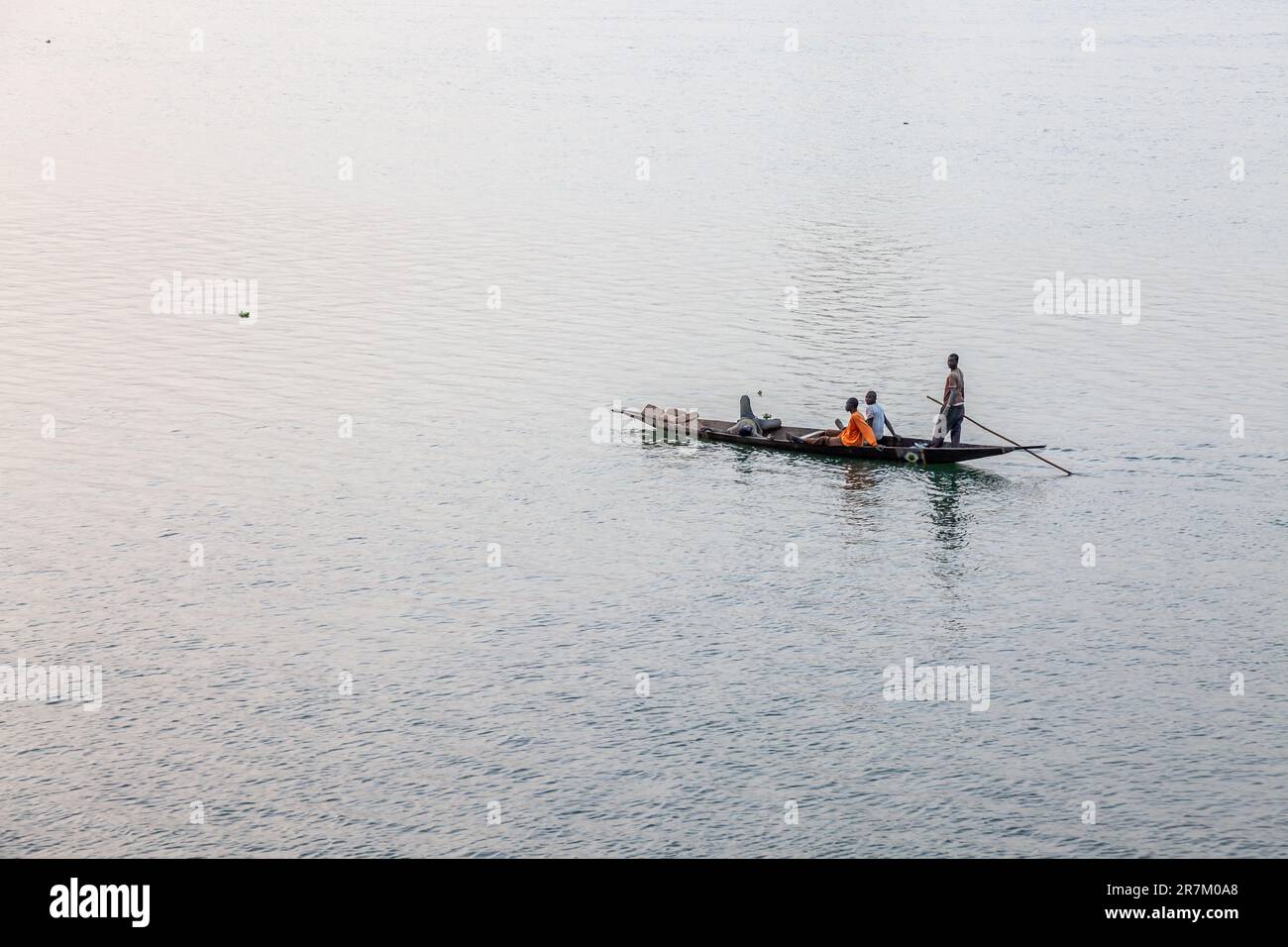 Fishermen on their canoe navigaing on the Niger River in Bamako, Mali ...