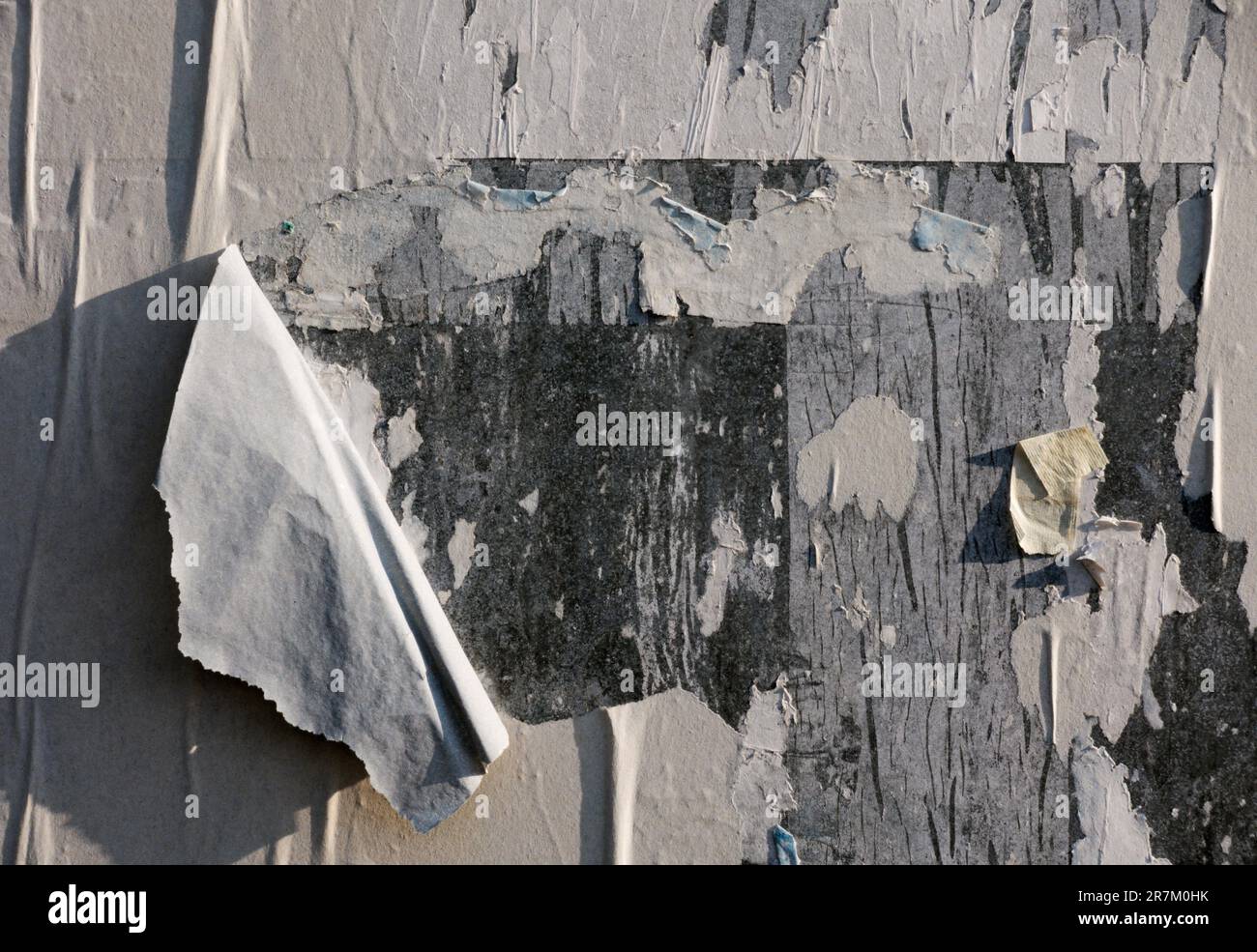 torn poster paper layers on wall Stock Photo - Alamy