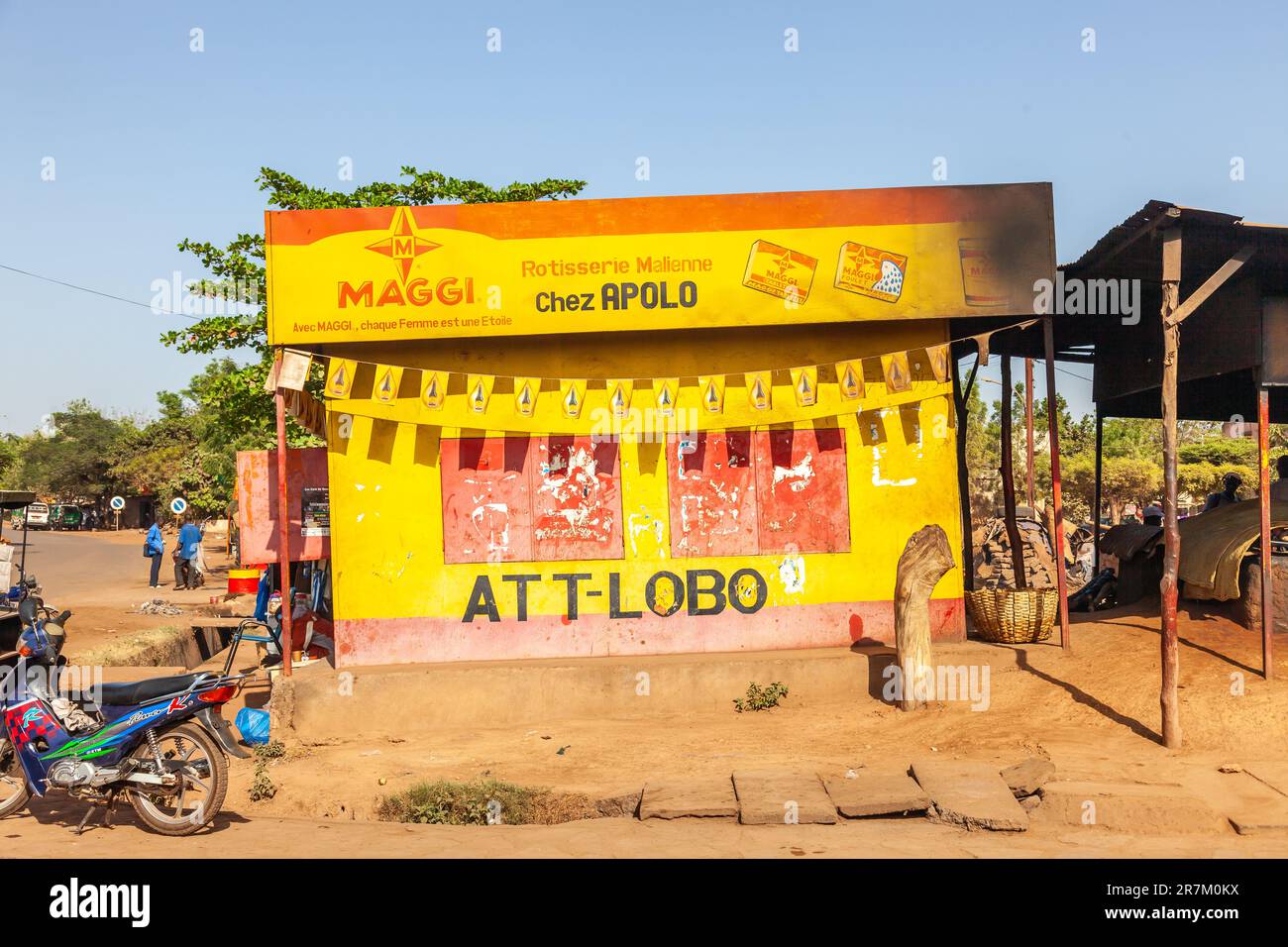 Yellow and red cabanon under the sign of Apolo, a Malian grill. Bamako ...