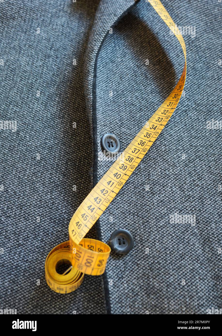 measuring tape and woman's jacket Stock Photo - Alamy