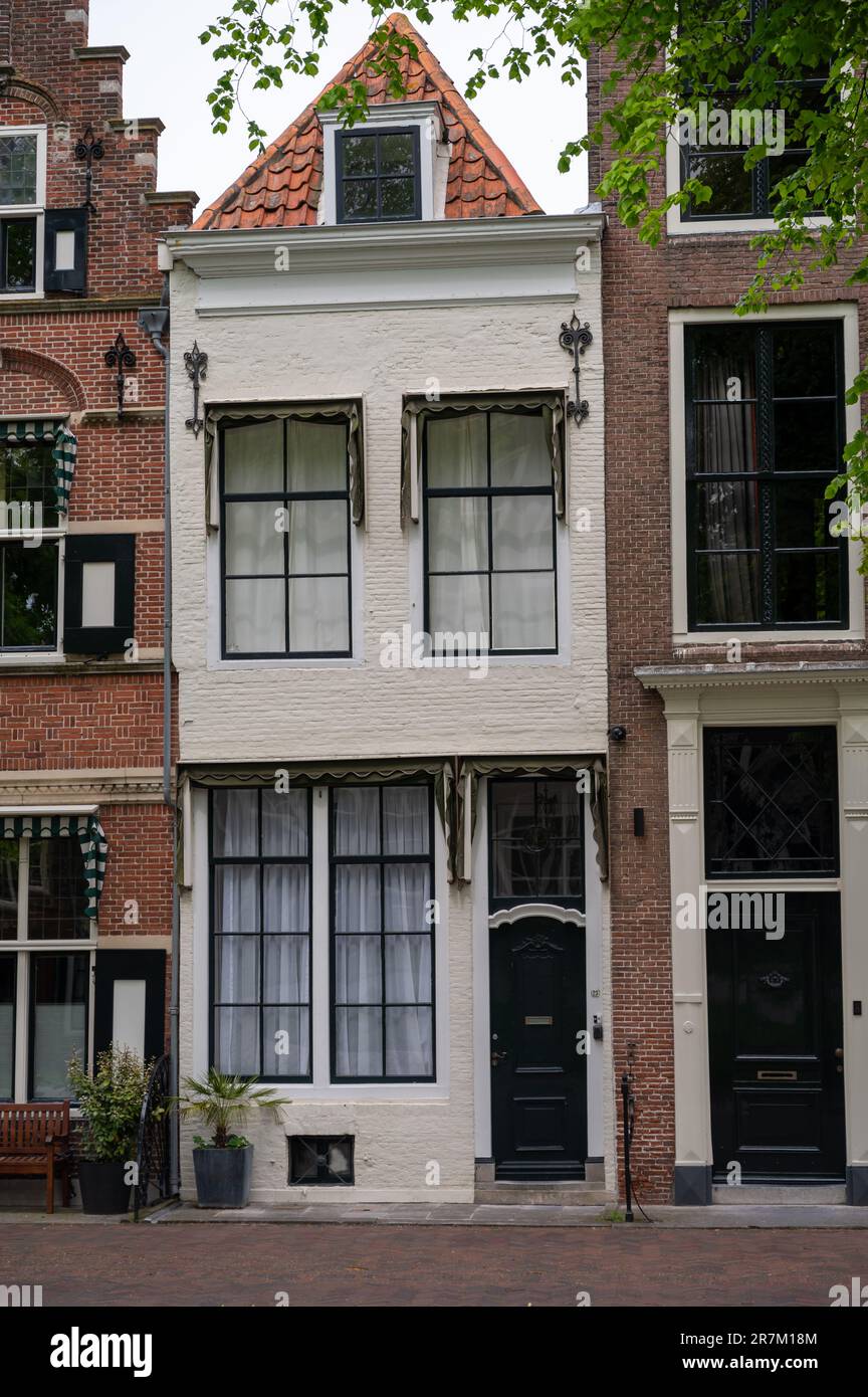 Walking in old Dutch town Zierikzee with old small houses and narrow ...