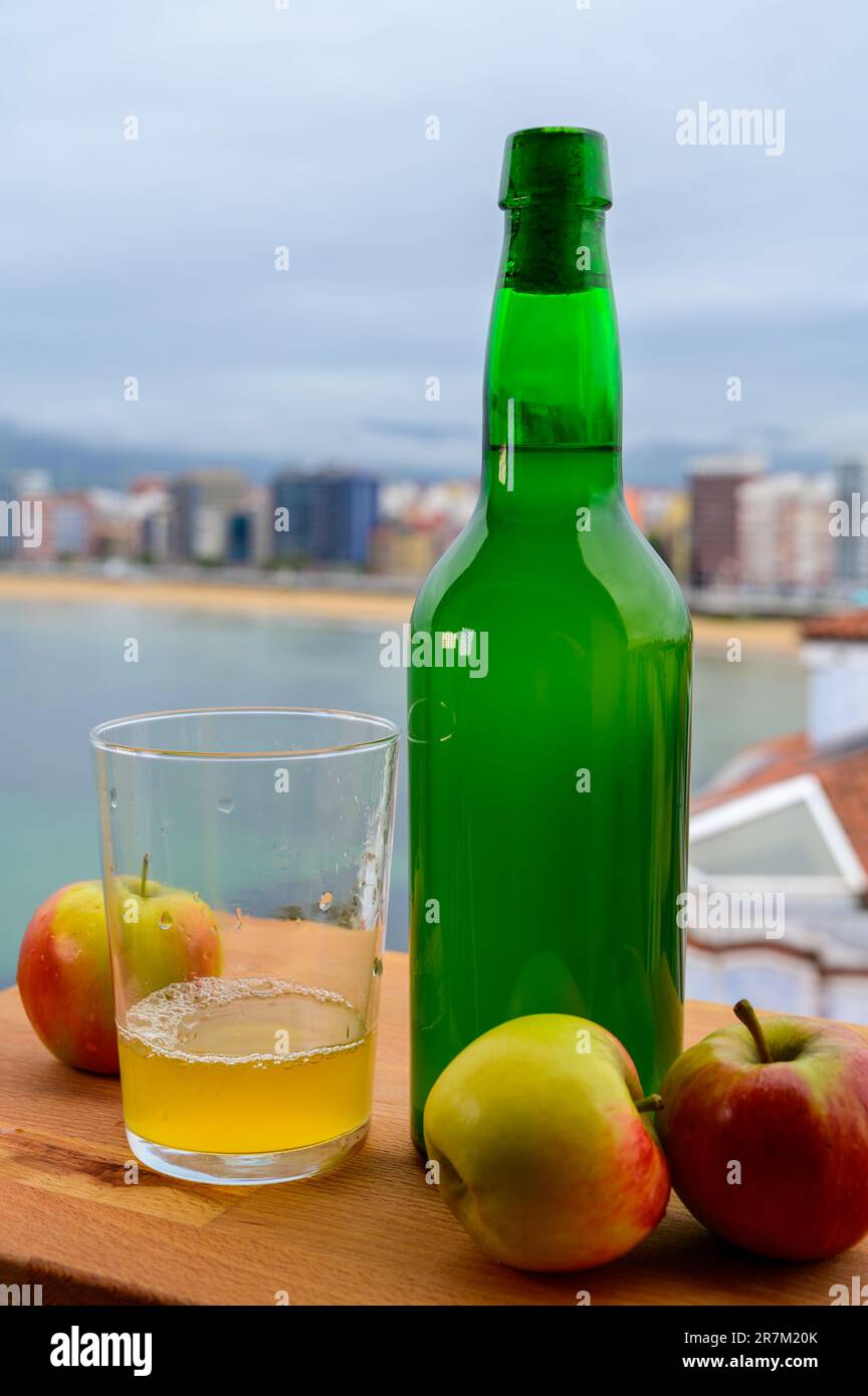 Traditional natural Asturian cider made from fermented apples in wooden ...