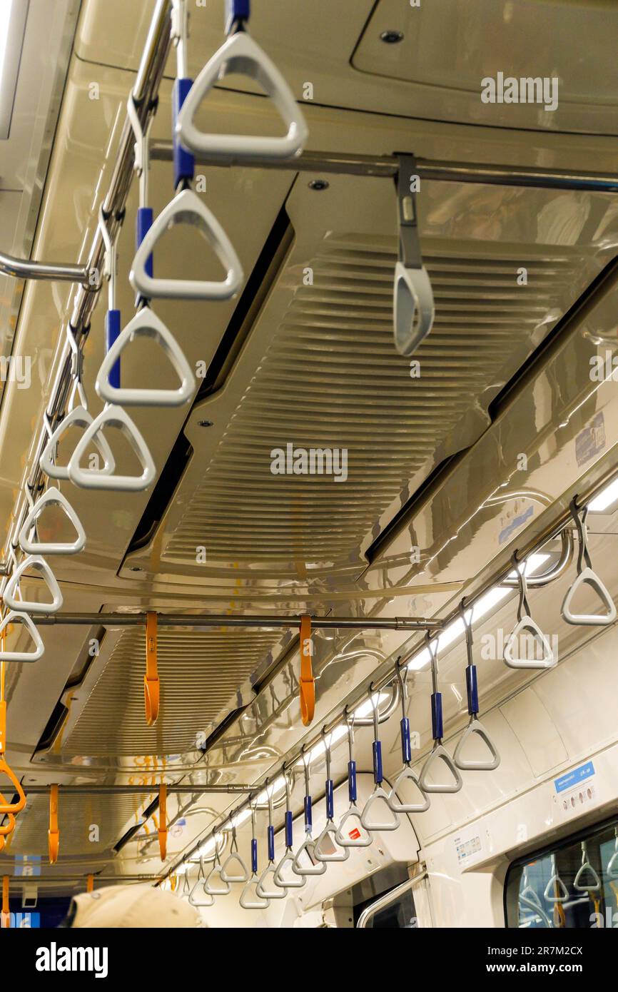 This image depicts a handle on the side of a train carriage designed to ...