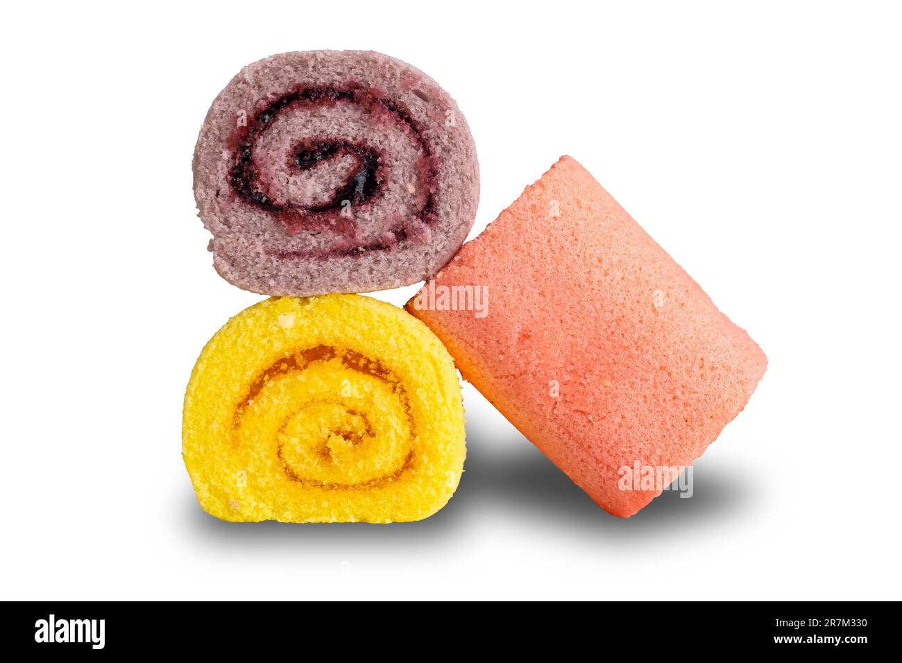Front view of different colored homemade roll cakes isolated on white ...