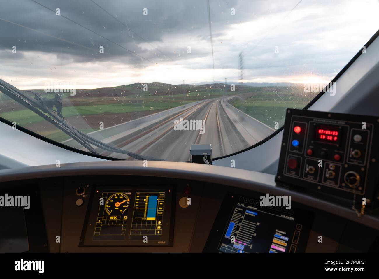 Motion blur view of railway from inside high speed train at evening and ...