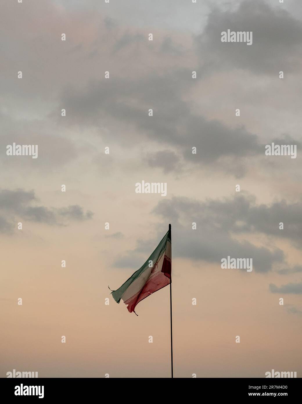 A vibrant, large-scale flag featuring the colors red, white, and green ...