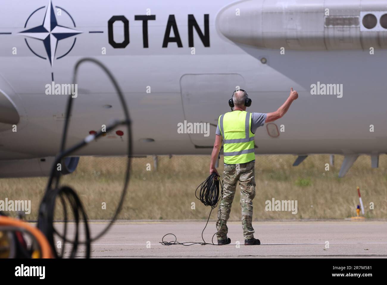 Geilenkirchen, Germany. 16th June, 2023. A crew member stands in front ...