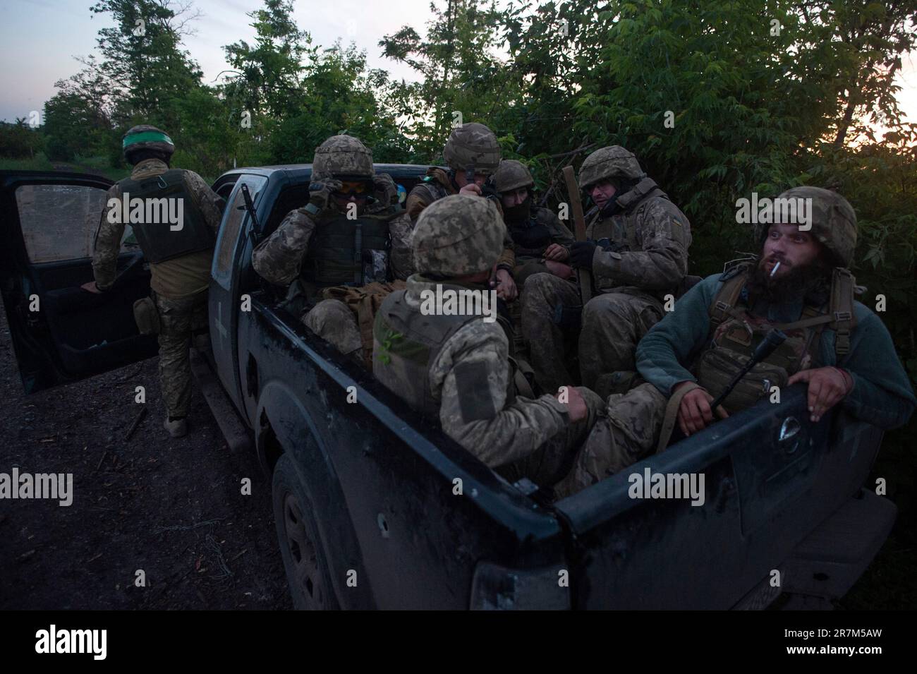 Ukrainian soldiers sit in a pickup truck at their position on the ...