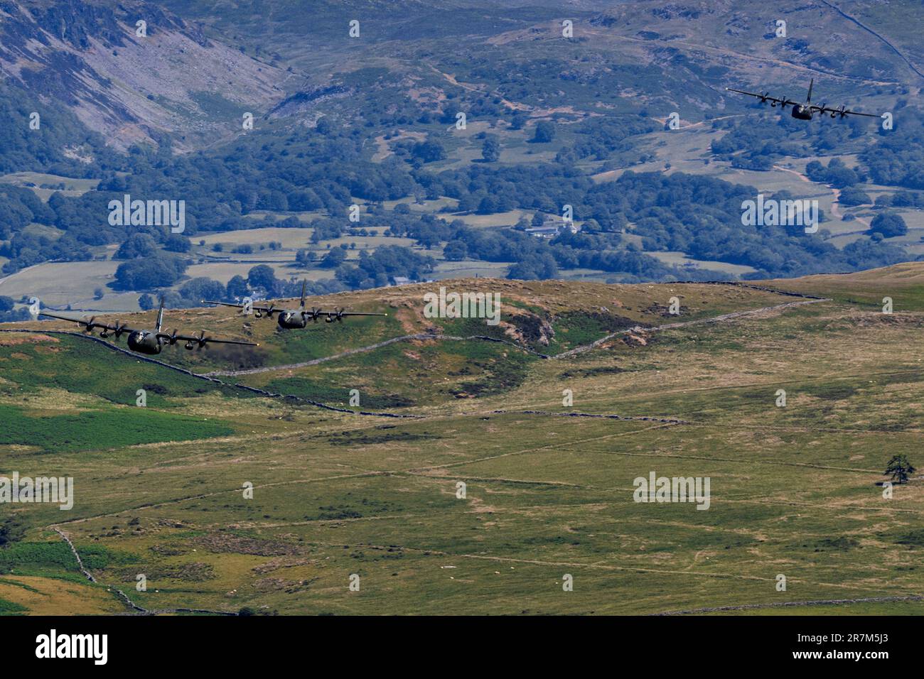 three RAF Hercules C130 pass through The Mach Loop in North Wales as ...