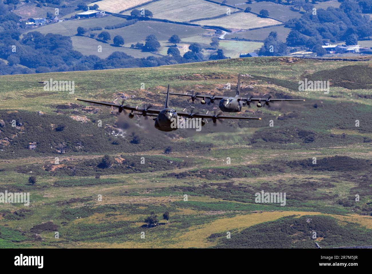 three RAF Hercules C130 pass through The Mach Loop in North Wales as ...