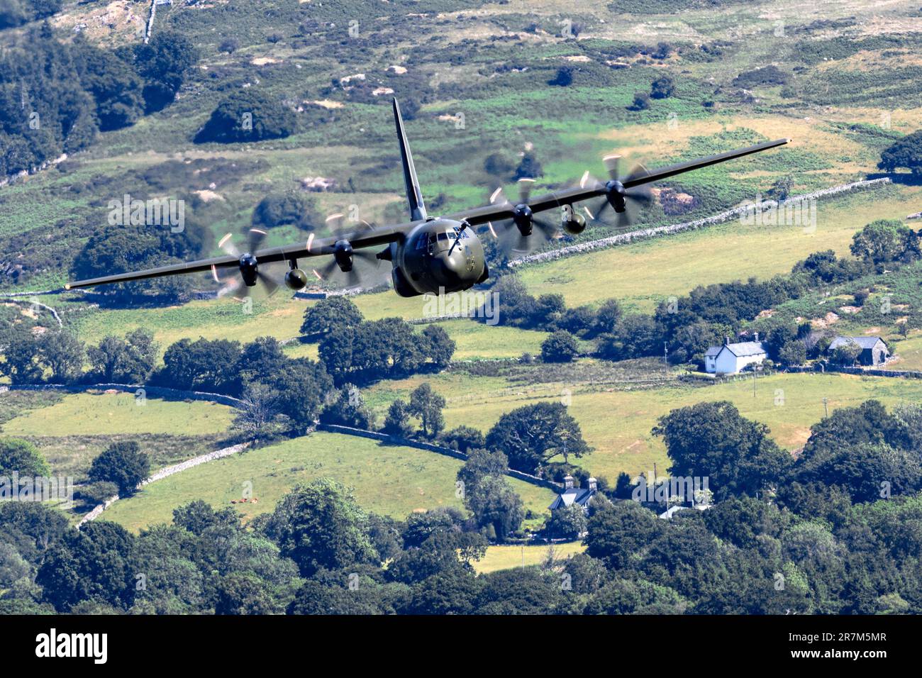 three RAF Hercules C130 pass through The Mach Loop in North Wales as ...
