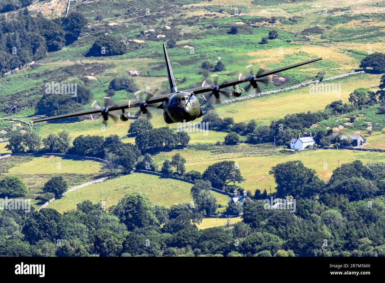 three RAF Hercules C130 pass through The Mach Loop in North Wales as ...