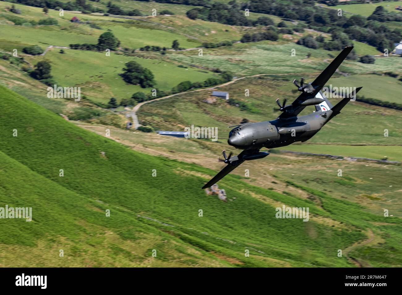 three RAF Hercules C130 pass through The Mach Loop in North Wales as ...