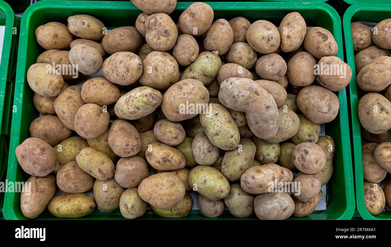 A group of potatoes in a box. Potatoes background in a box Stock Photo ...