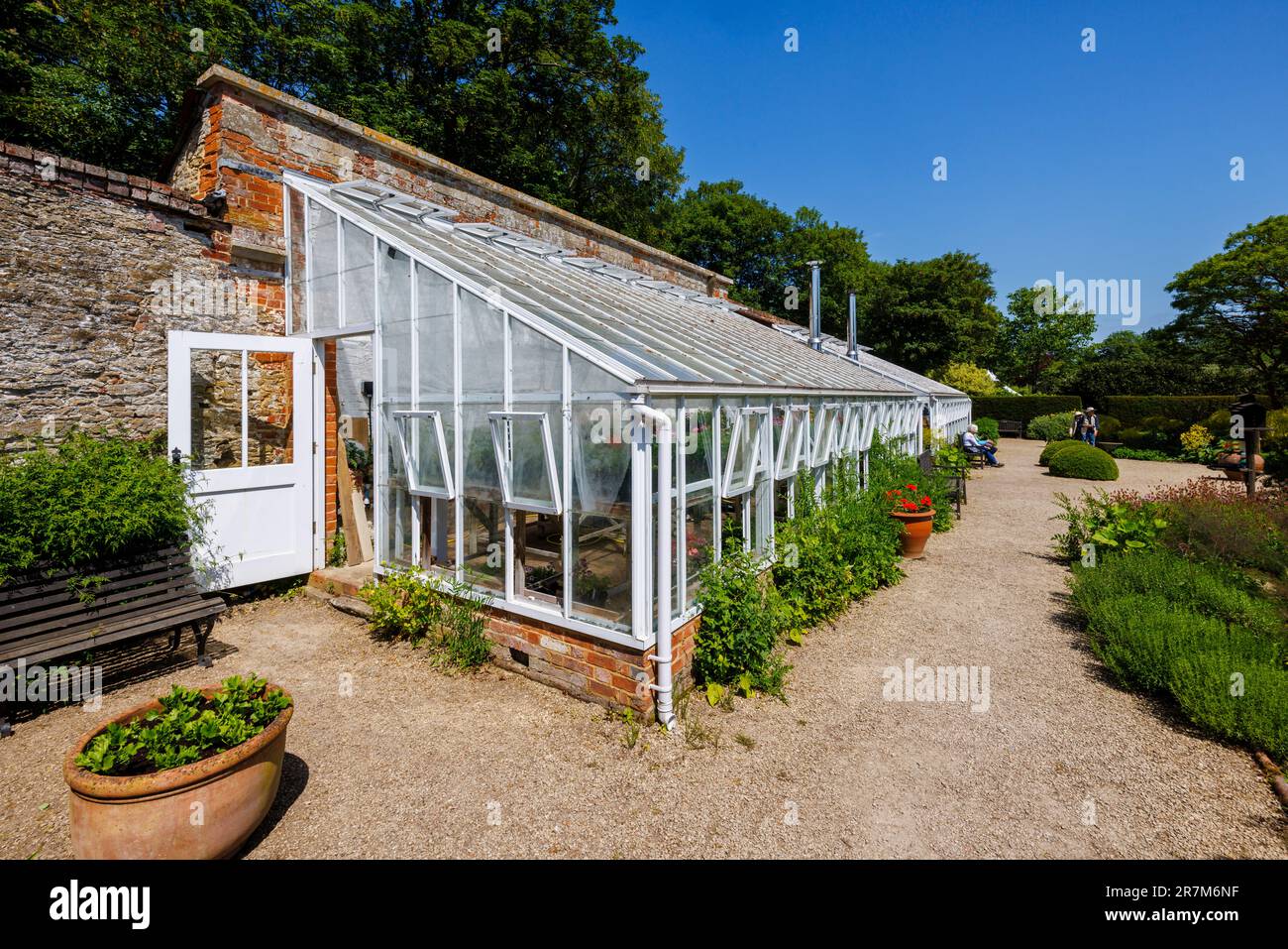 A traditional old-fashioned lean-to design glasshouse (greenhouse) at ...