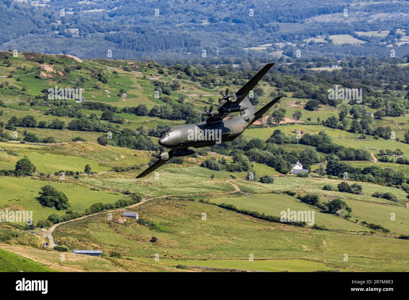 three RAF Hercules C130 pass through The Mach Loop in North Wales as ...