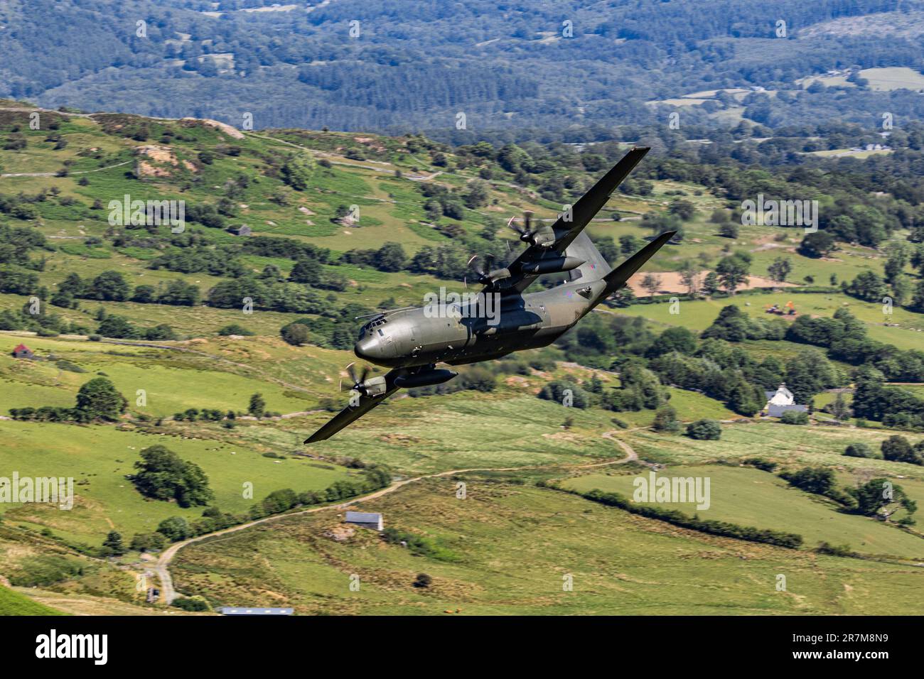 three RAF Hercules C130 pass through The Mach Loop in North Wales as ...