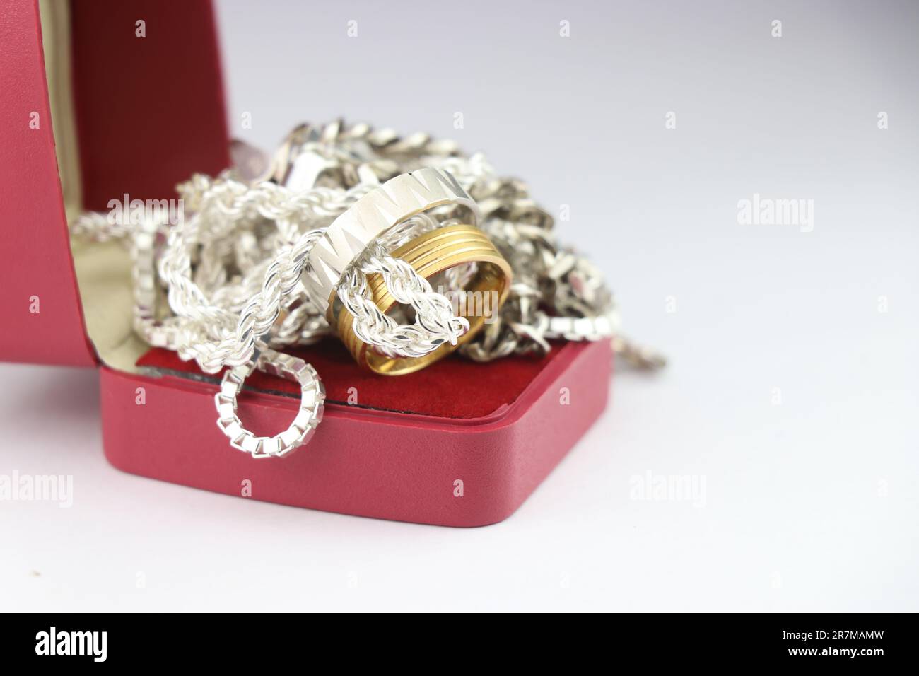 Silver and gold jewelry in a box on a white background. Beautiful ...