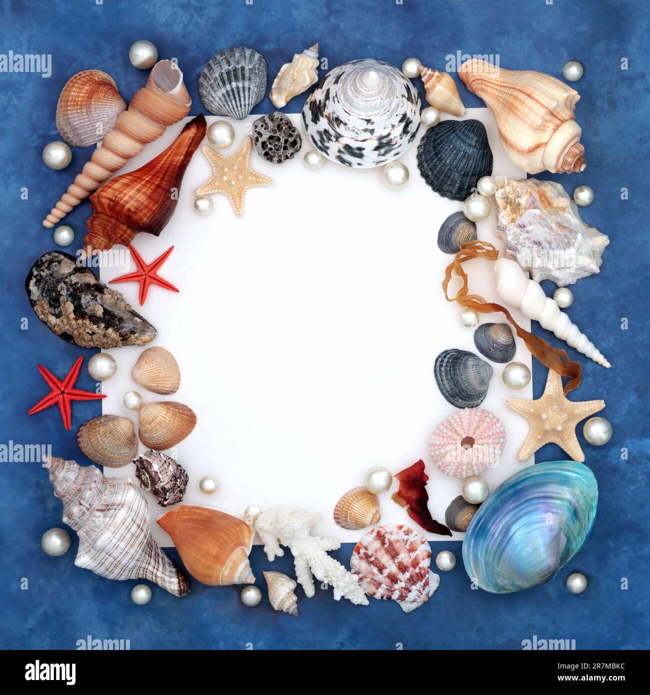 Seashell and pearl abstract background border on rustic mottled blue ...