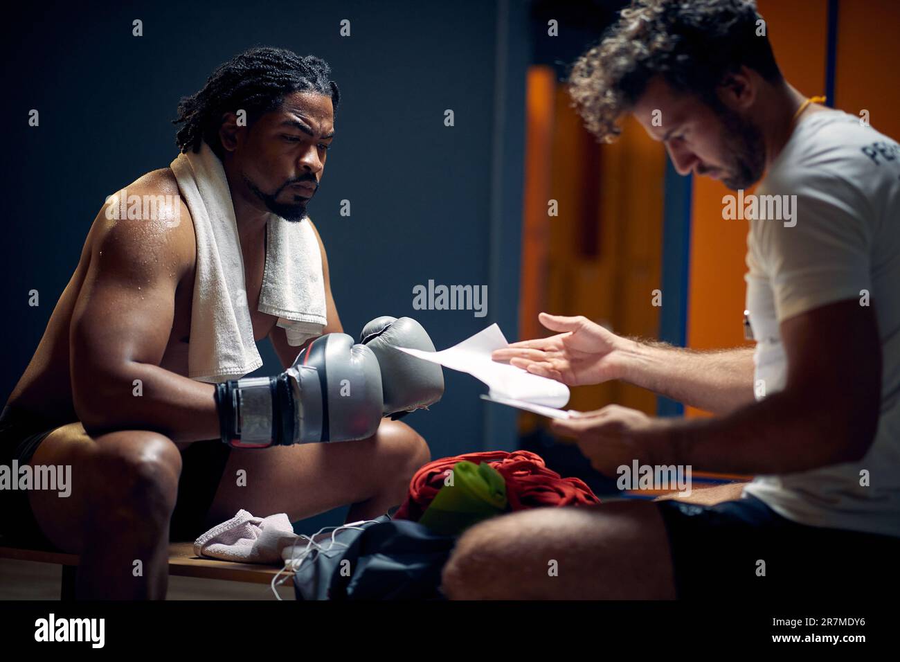 Determined boxing player with serious face in sweats after workout ...