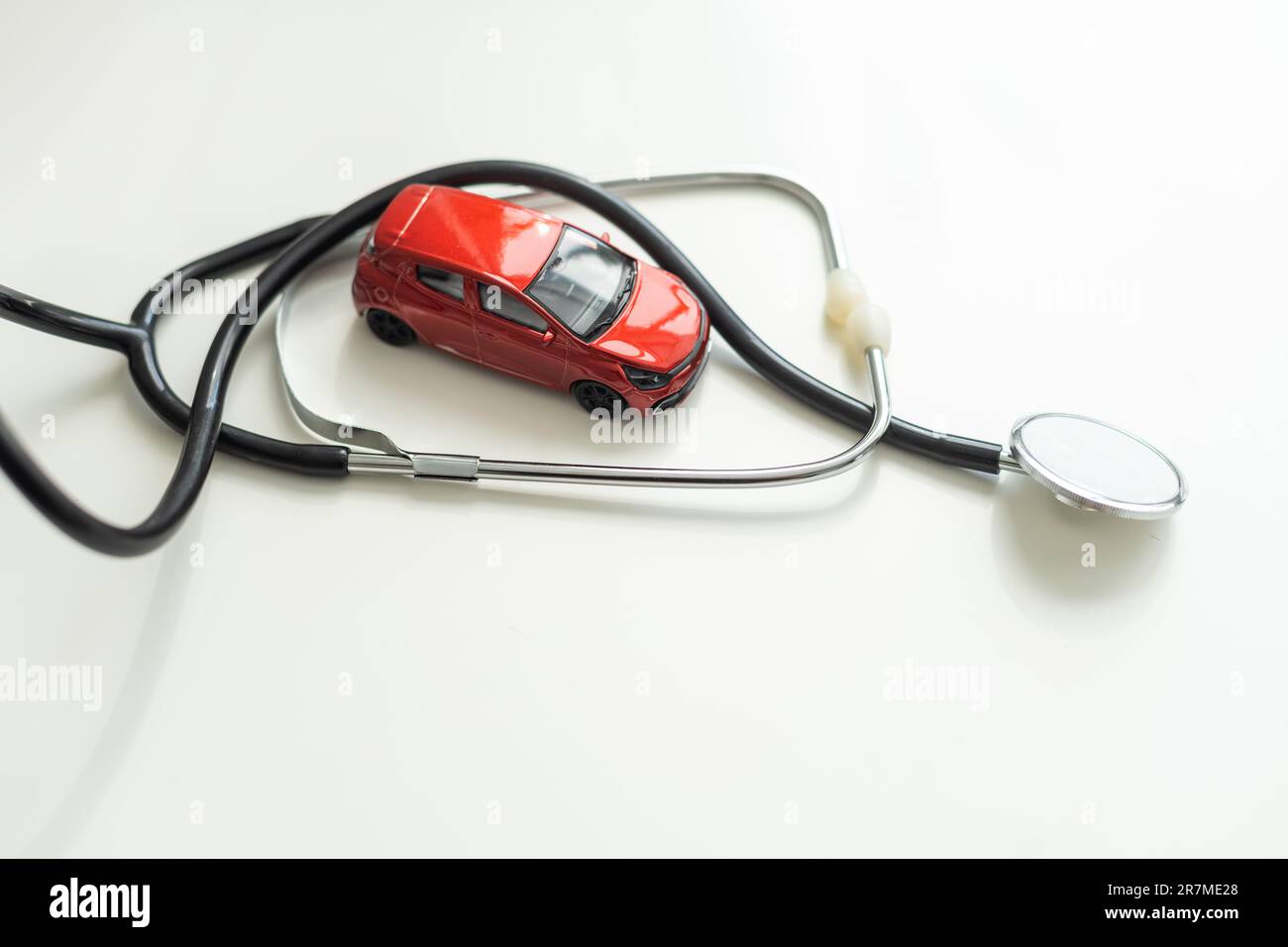 Toy car and stethoscope. Car automotive diagnostic, inspection, repair ...