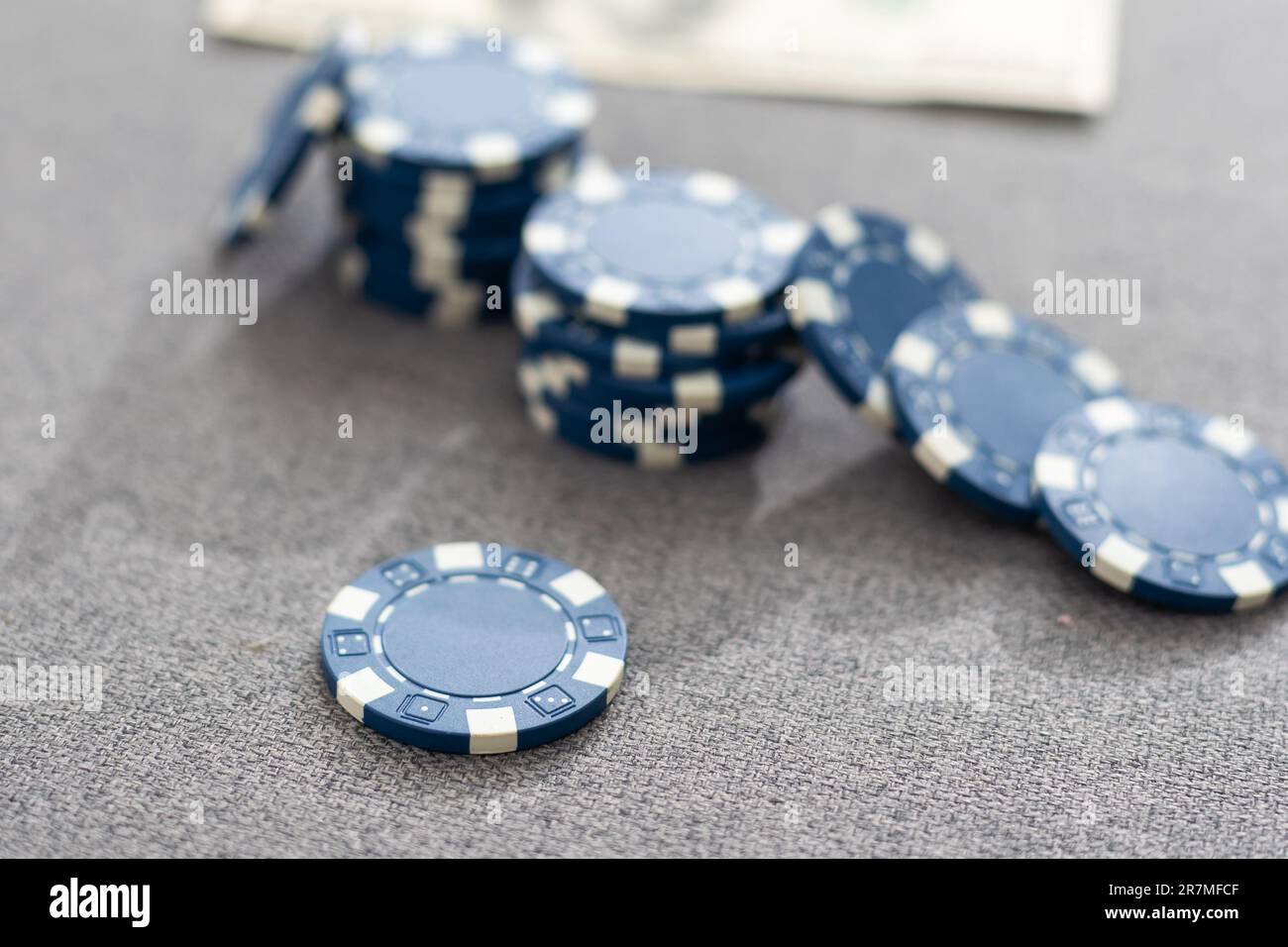 Blue poker chips on stock market chart background Stock Photo - Alamy