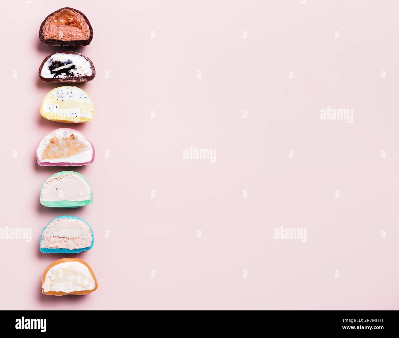 Japanese dessert mochi on a pink background with copy space. mochi with ...