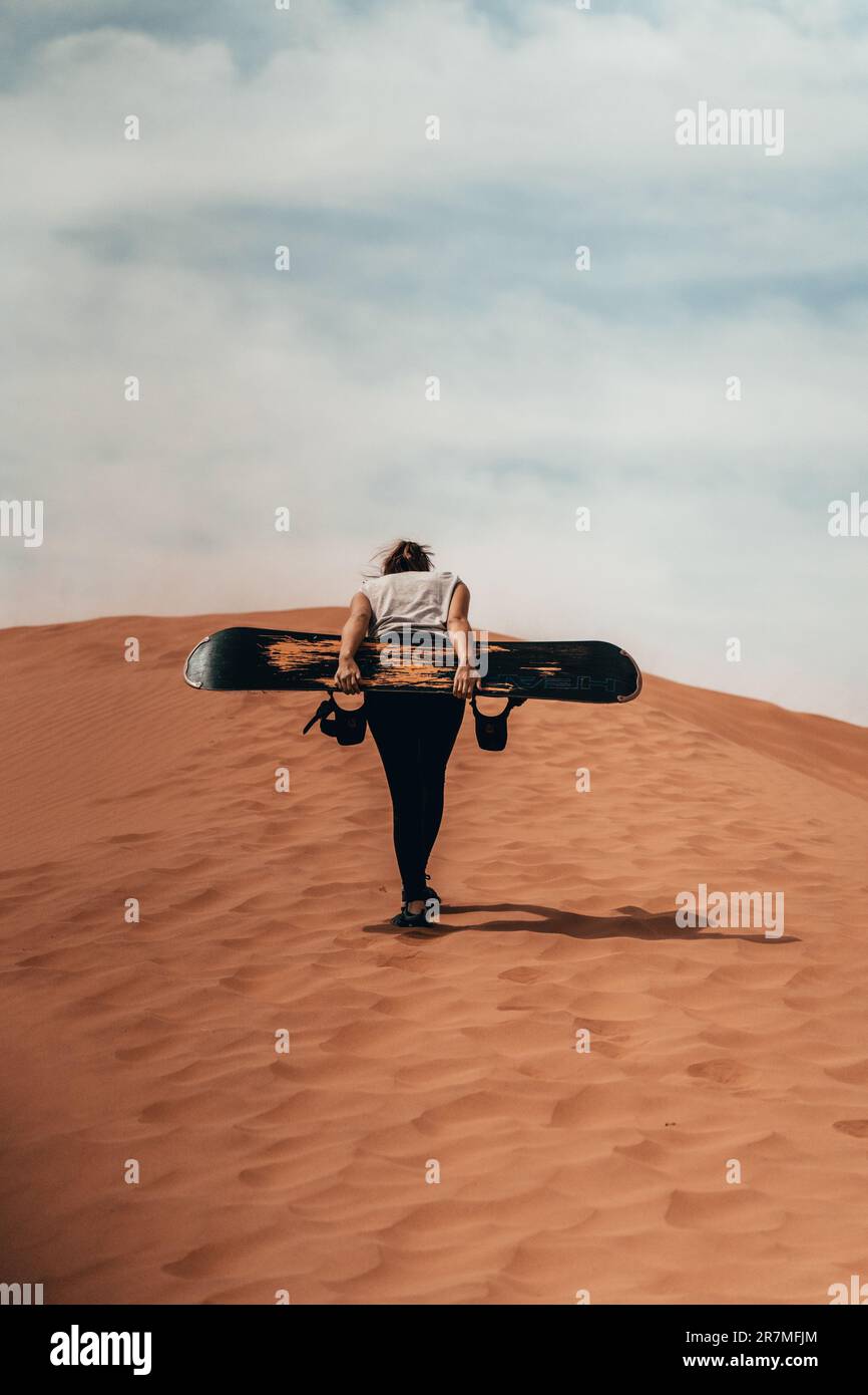 Woman sand boarding on hi-res stock photography and images - Alamy